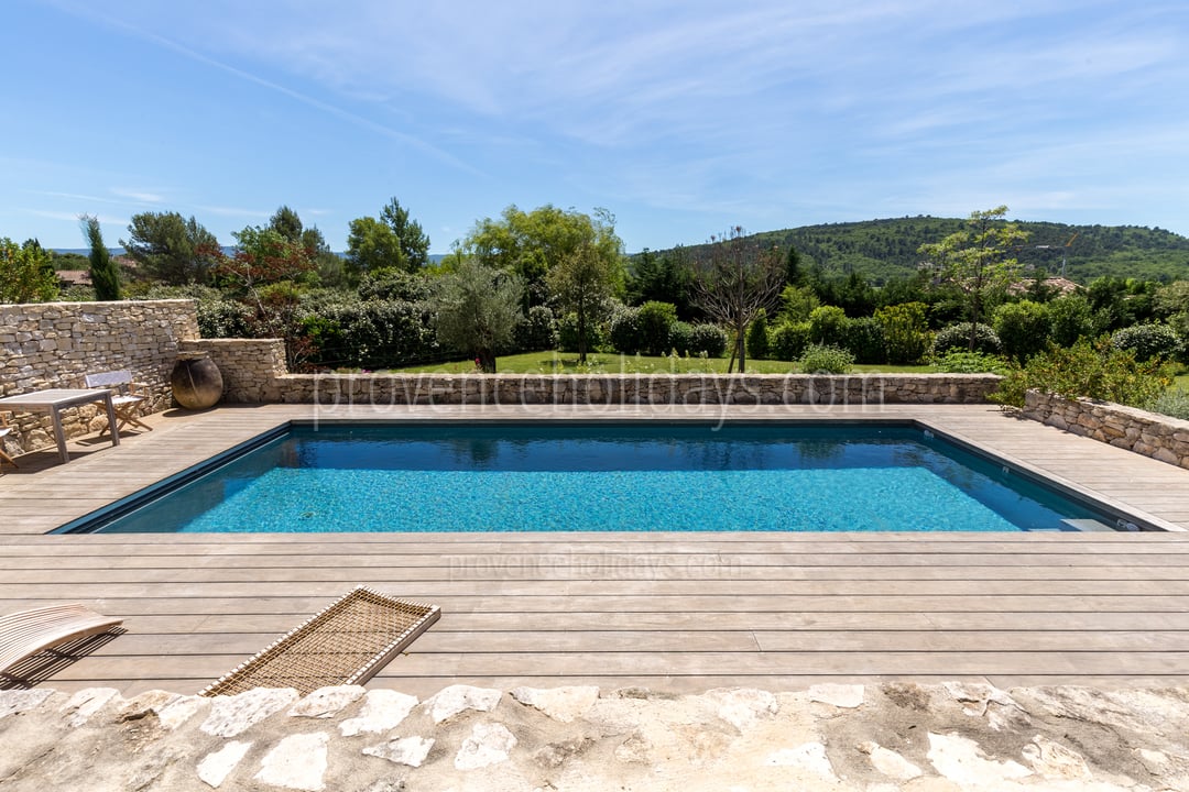 Contemporary stone villa with swimming pool and view of Gordes ...